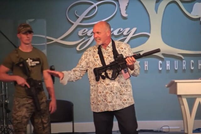 Pastor Wears AR-15 During Sermon To Illustrate “Violent Faith”